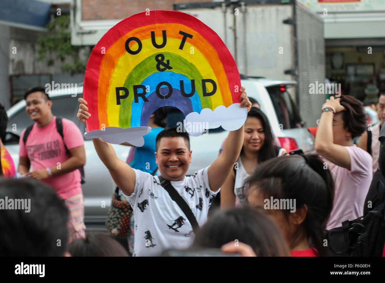 A members with a rainbow sign slogan. Thousands gathered around the ...