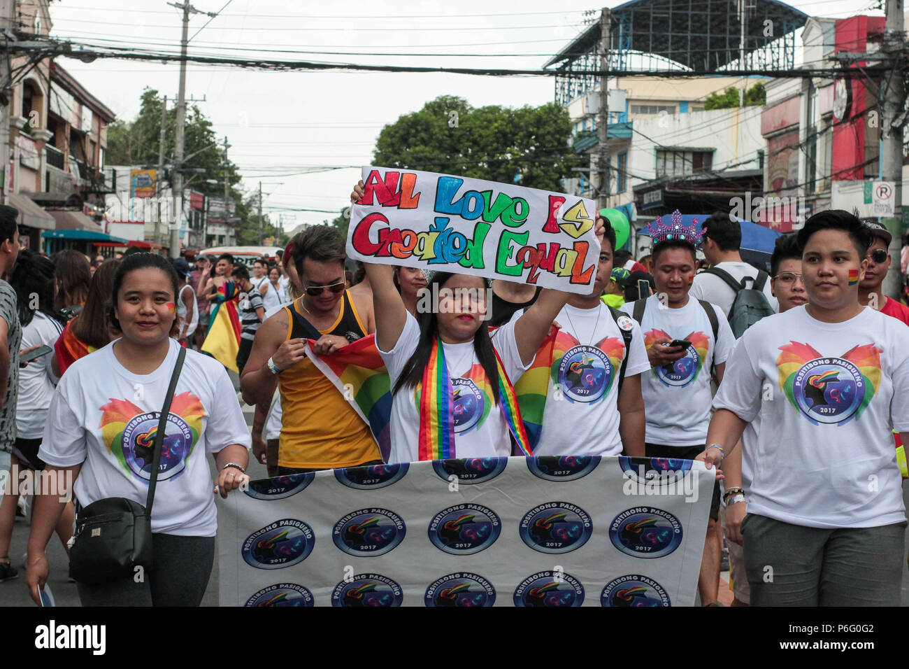 Participants with their slogan that promotes equality. Thousands ...