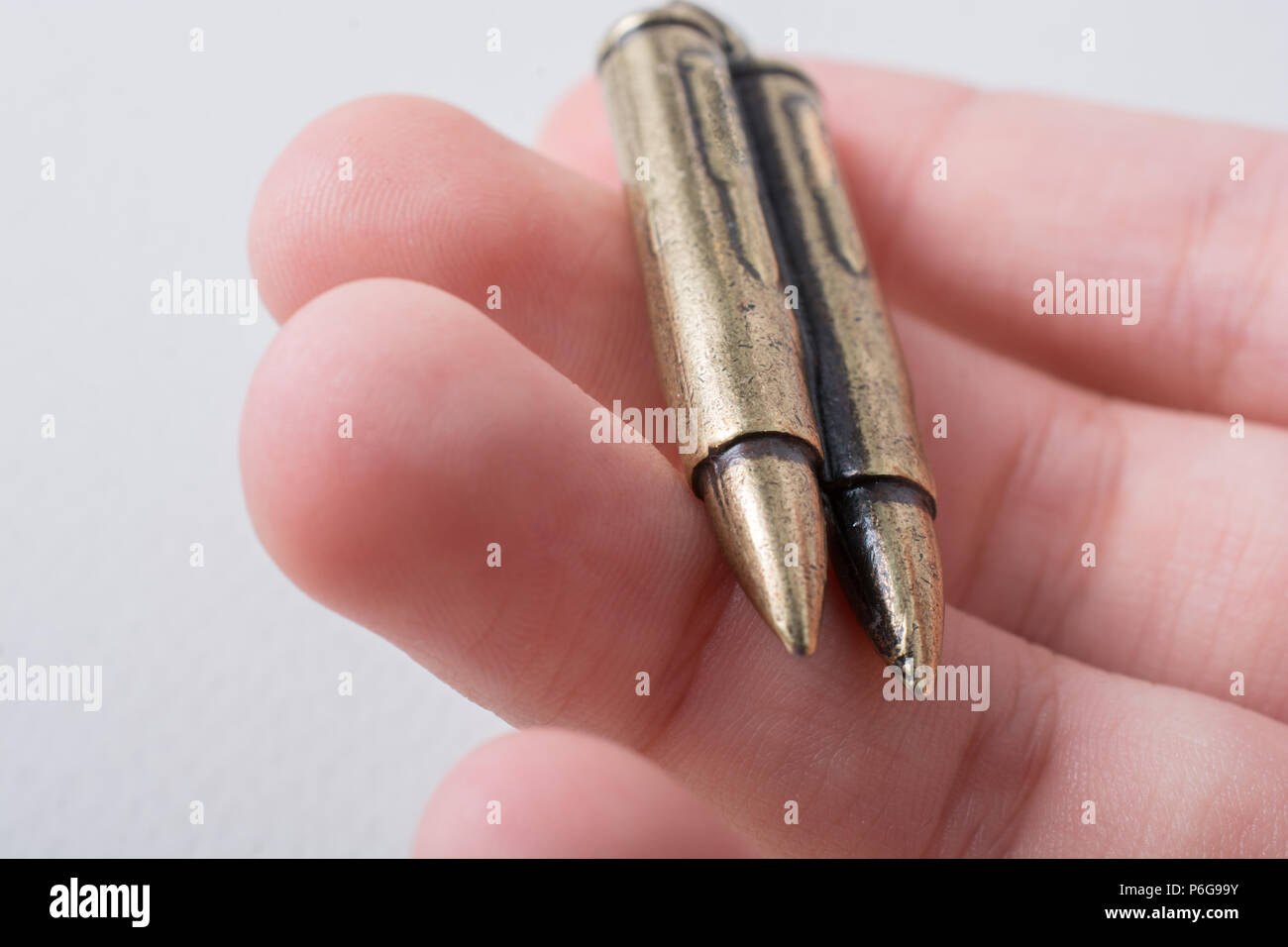 Bullet in the hand as Conceptual photography against the war Stock ...