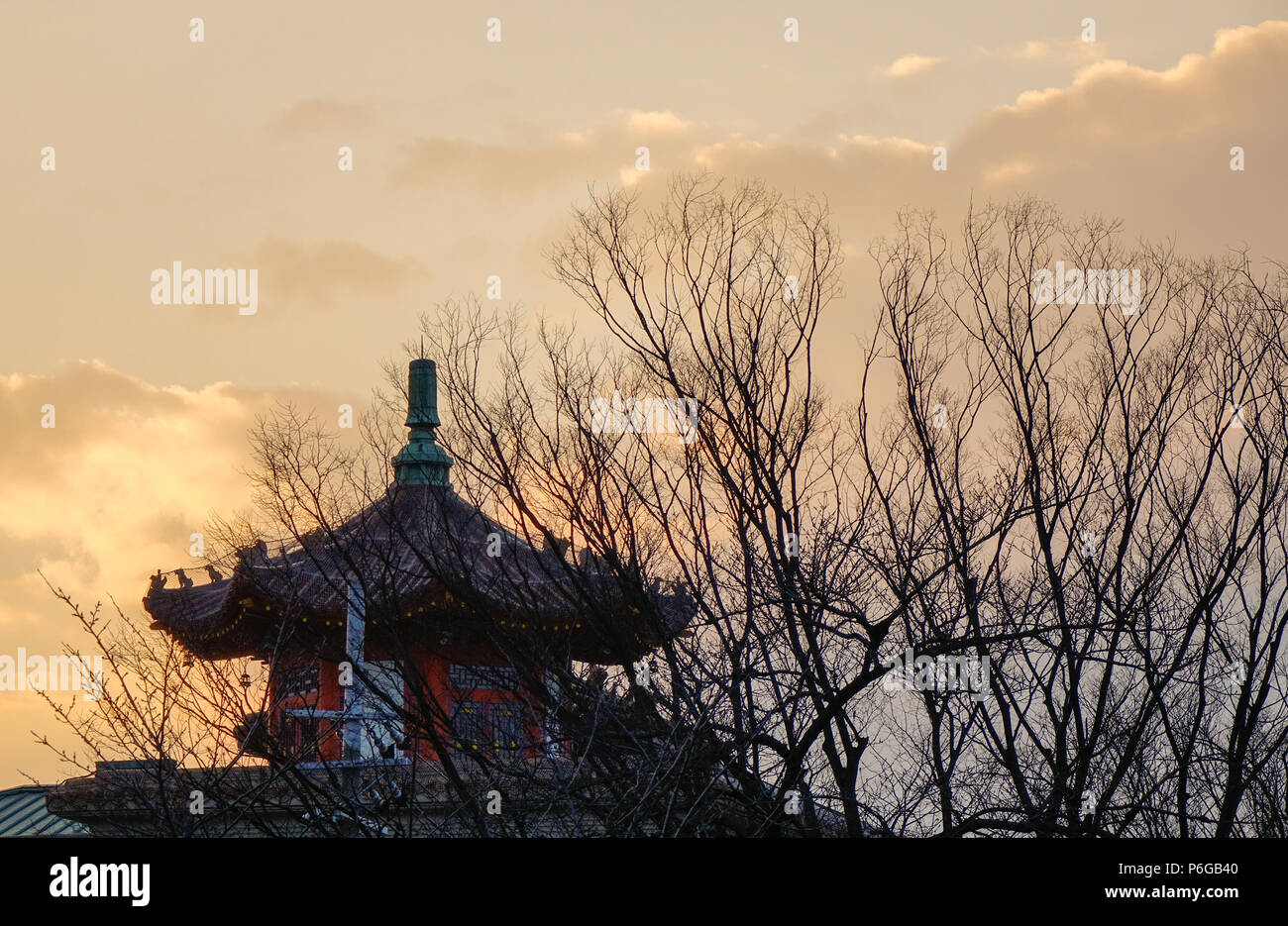 Top of ancient Buddhist temple at sunset in Kyoto, Japan Stock Photo ...