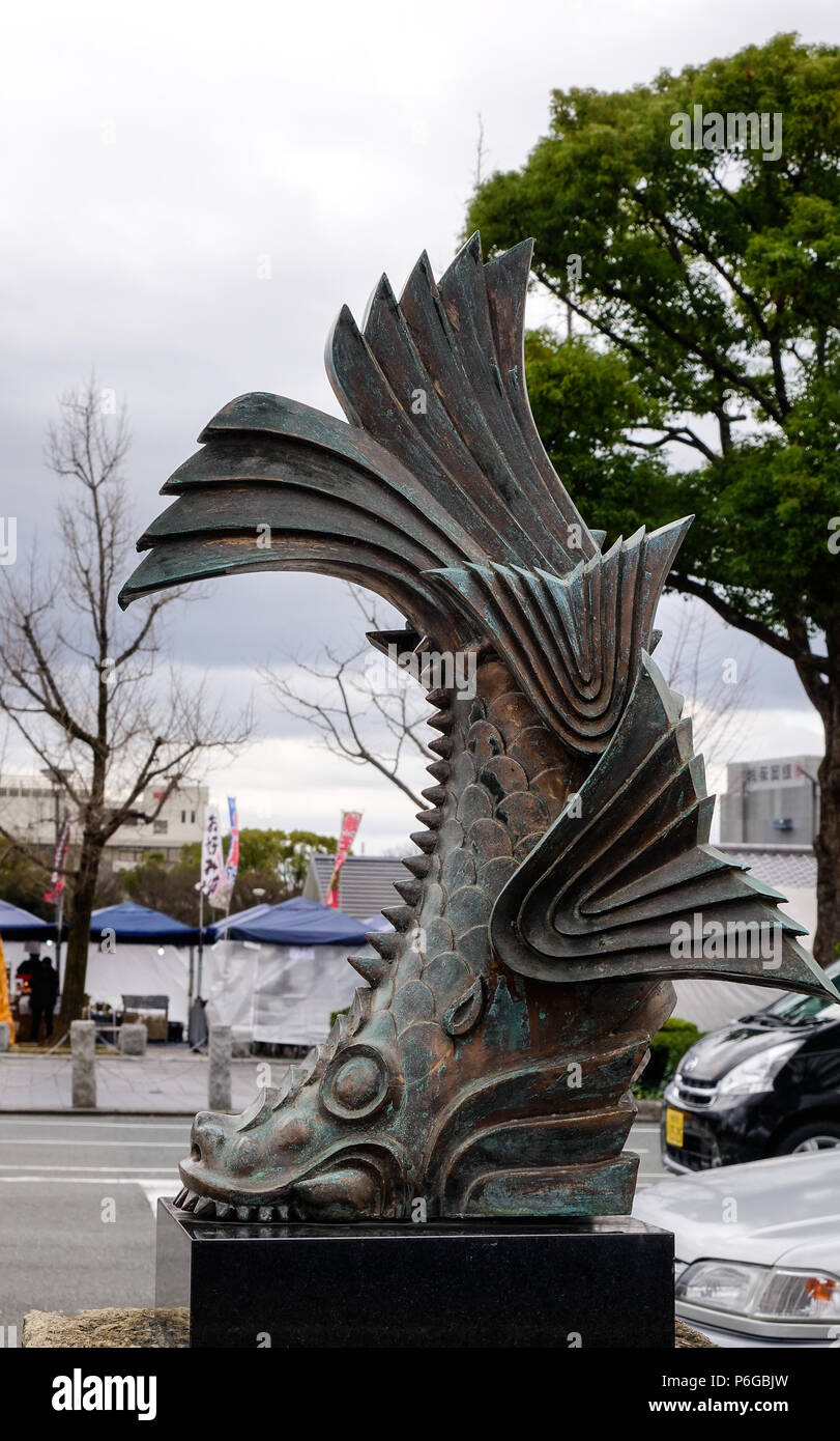 Himeji, Japan - Dec 27, 2015. Bronze statue of fish on street in Himeji ...