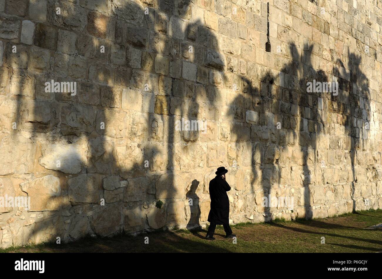 Israel. Jerusalem. Orthodox Jew walking along the walls of the Old City ...
