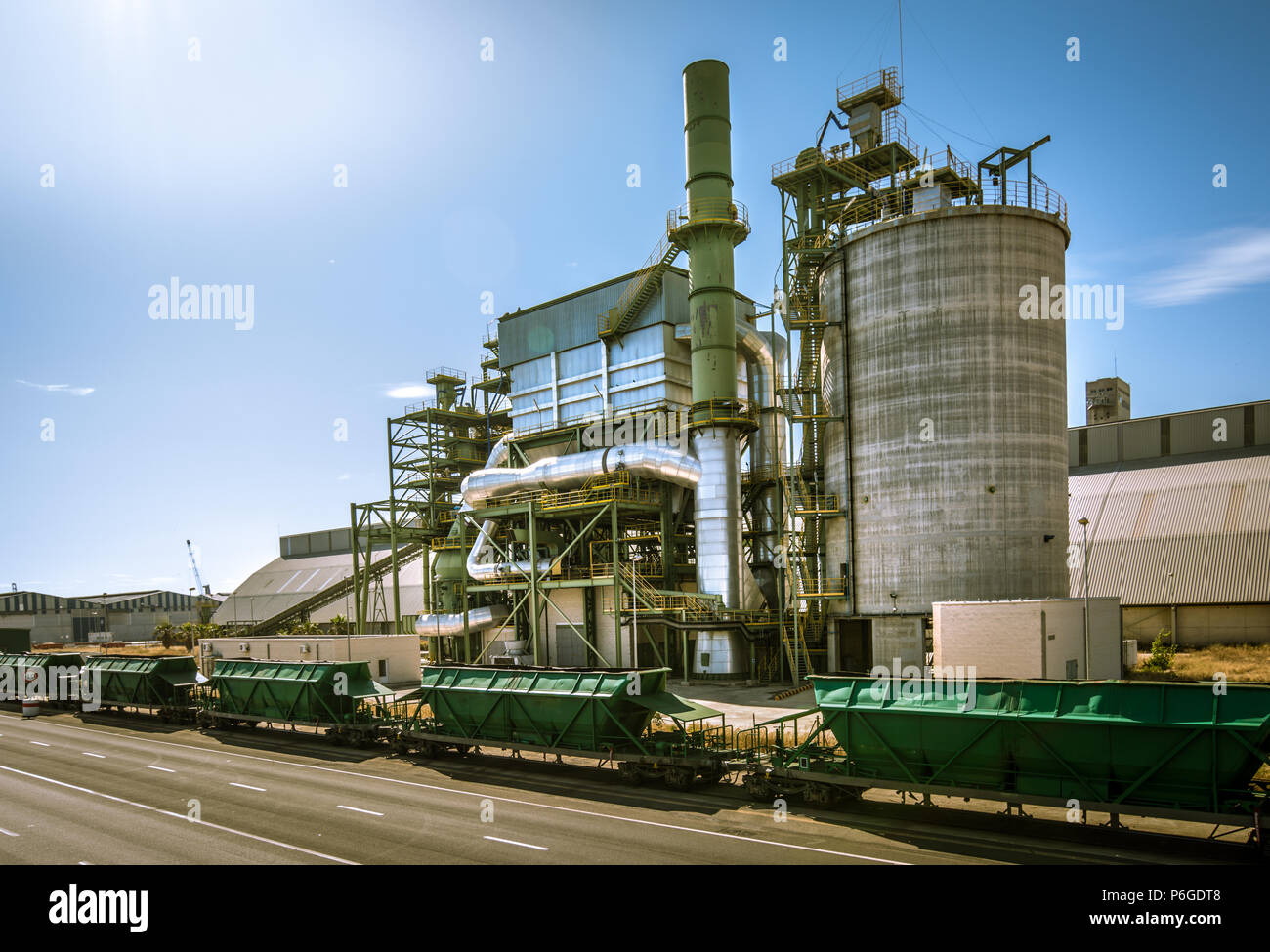 Old factory exterior with buildings and chimney Stock Photo - Alamy