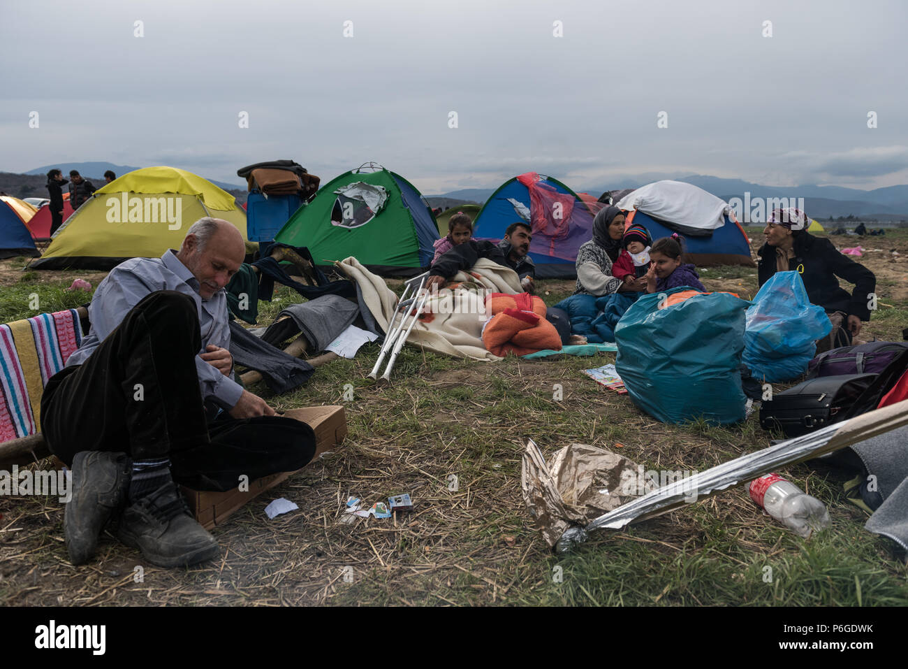 Refuge family rest at the makeshift camp of the Greek-Macedonian border ...