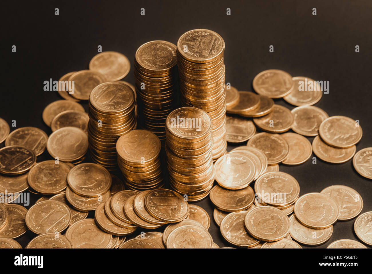 Savings, increasing columns of coins, piles of coins arranged as a ...