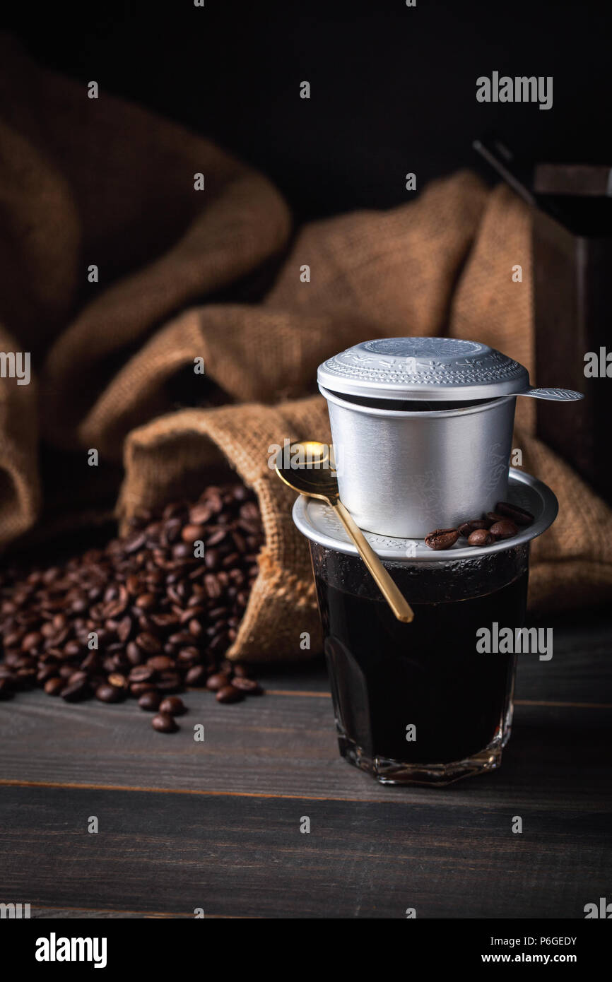Vintage vietnam coffee dripper, coffee cup and coffee beans with bag ...