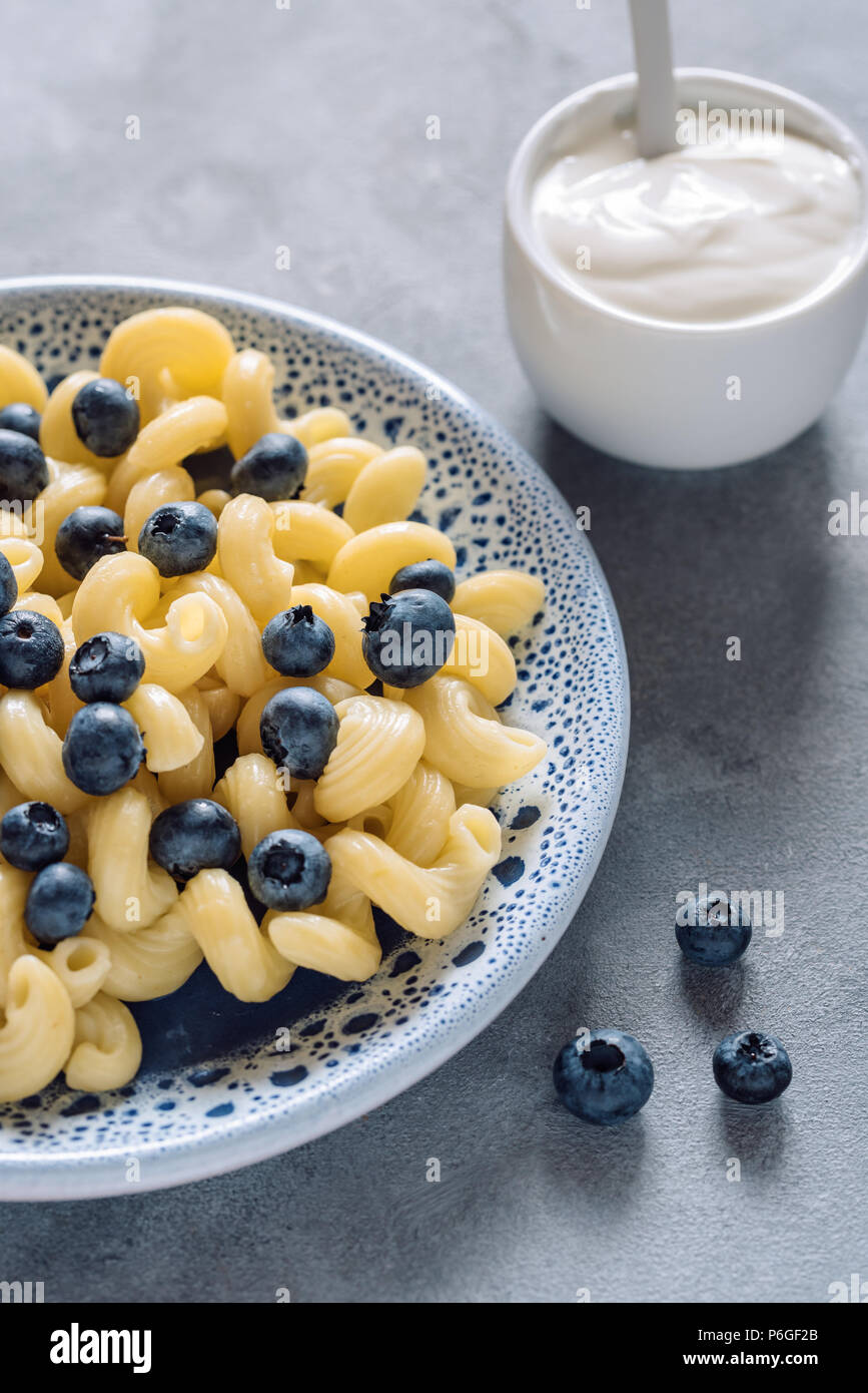 Pasta with blueberries and sour cream Stock Photo - Alamy