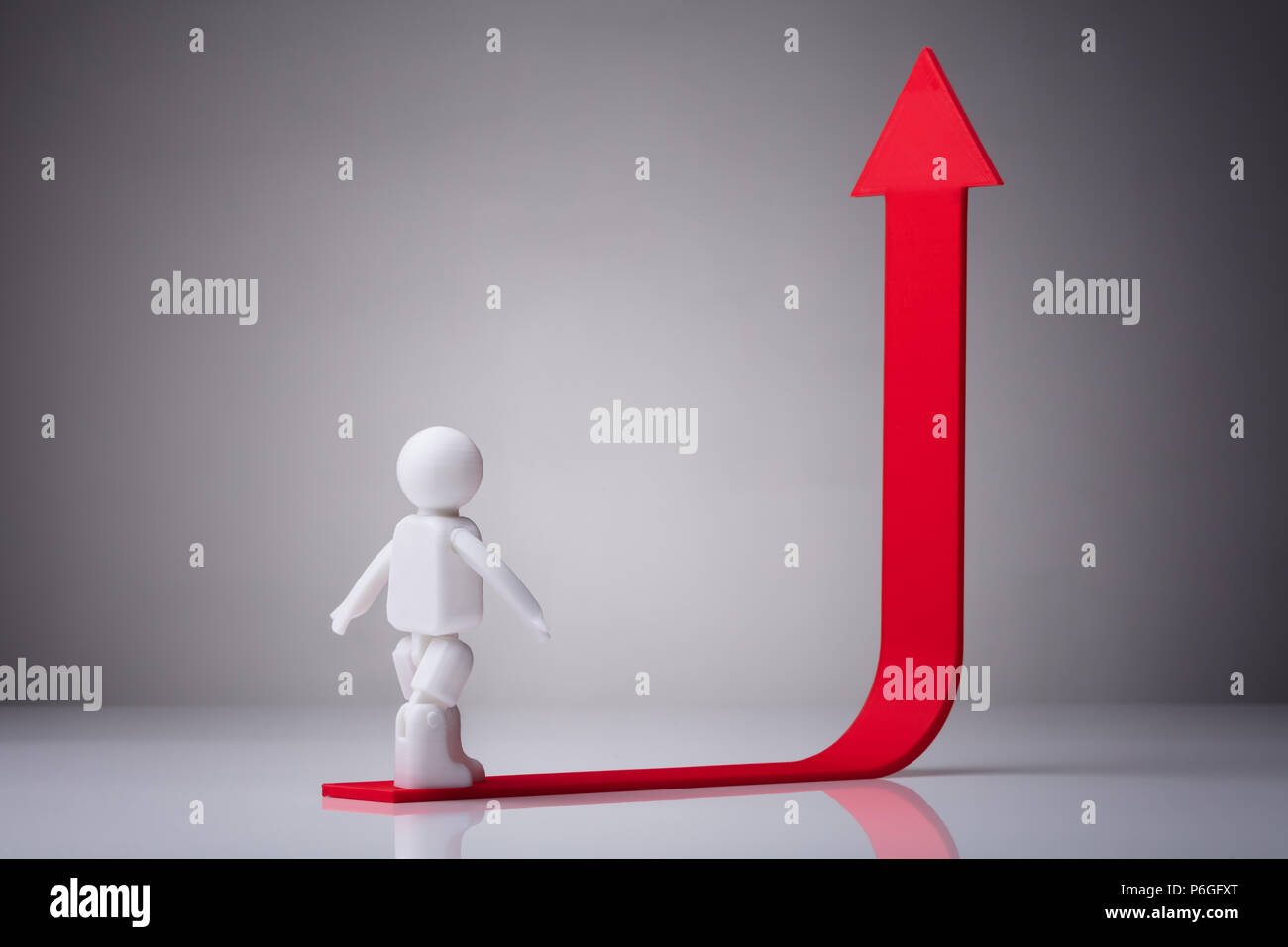 Human Figure Walking On Red Arrow Pointing Upward Stock Photo - Alamy