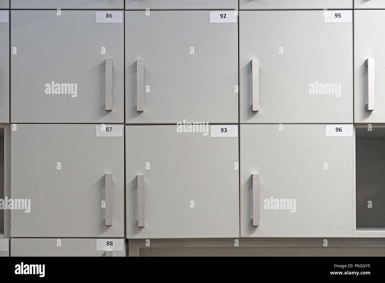 Small lockers storage compartments with numbers Stock Photo - Alamy
