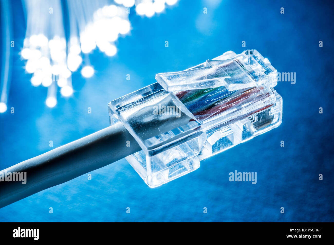 Network cables and optical fibers with lights in the ends. Blue ...
