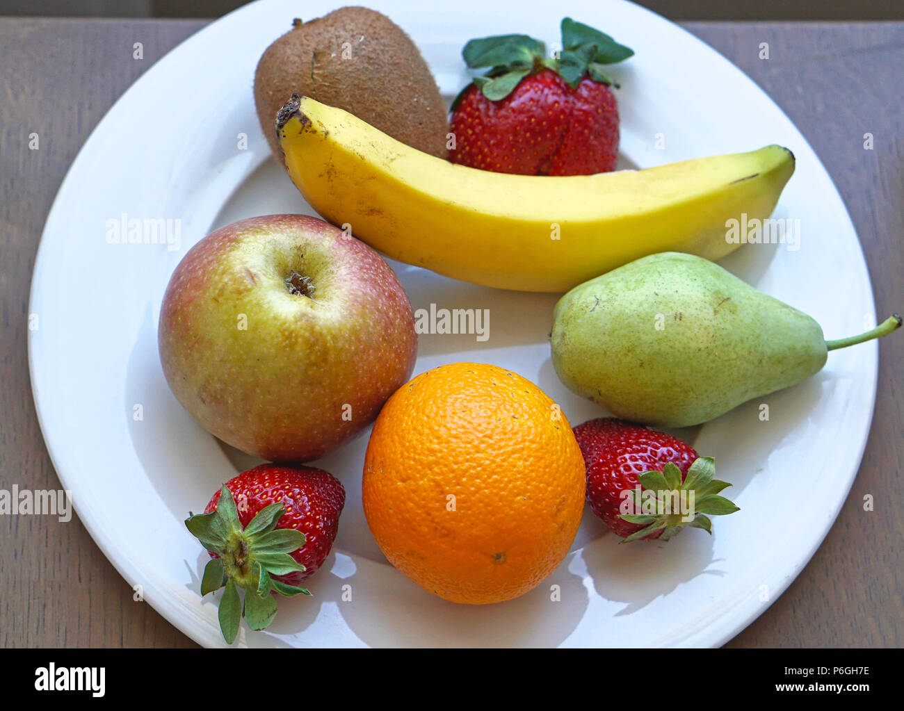 Mix of fresh fruits served at platter Stock Photo - Alamy