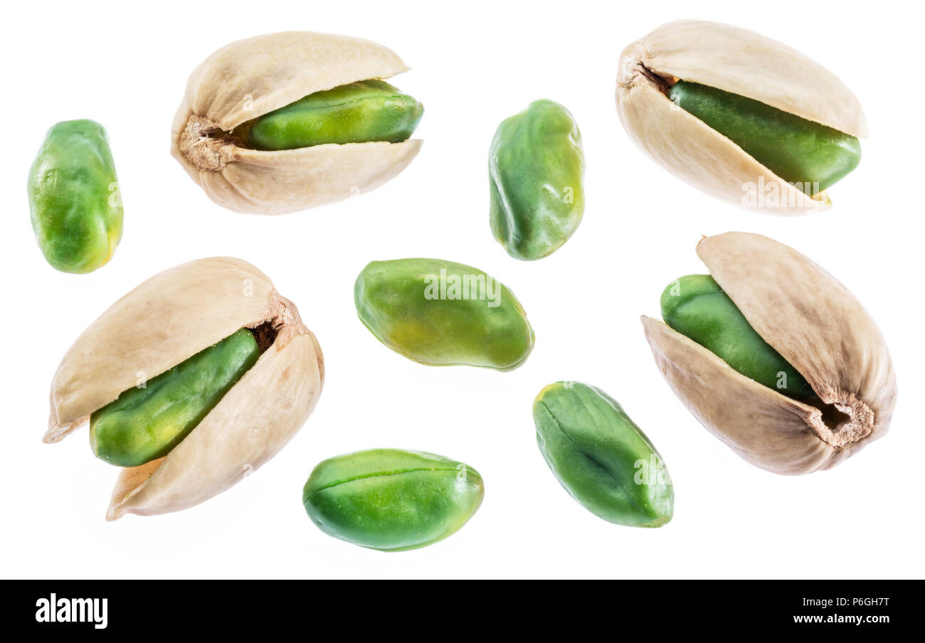 Green pistachio nuts with pistachio shell on white background Stock ...