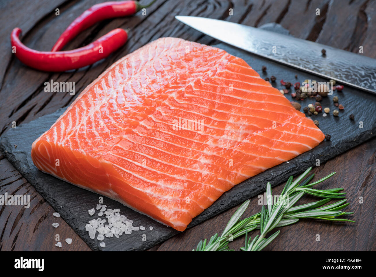 Salmon steak fillet herbs hi-res stock photography and images - Alamy