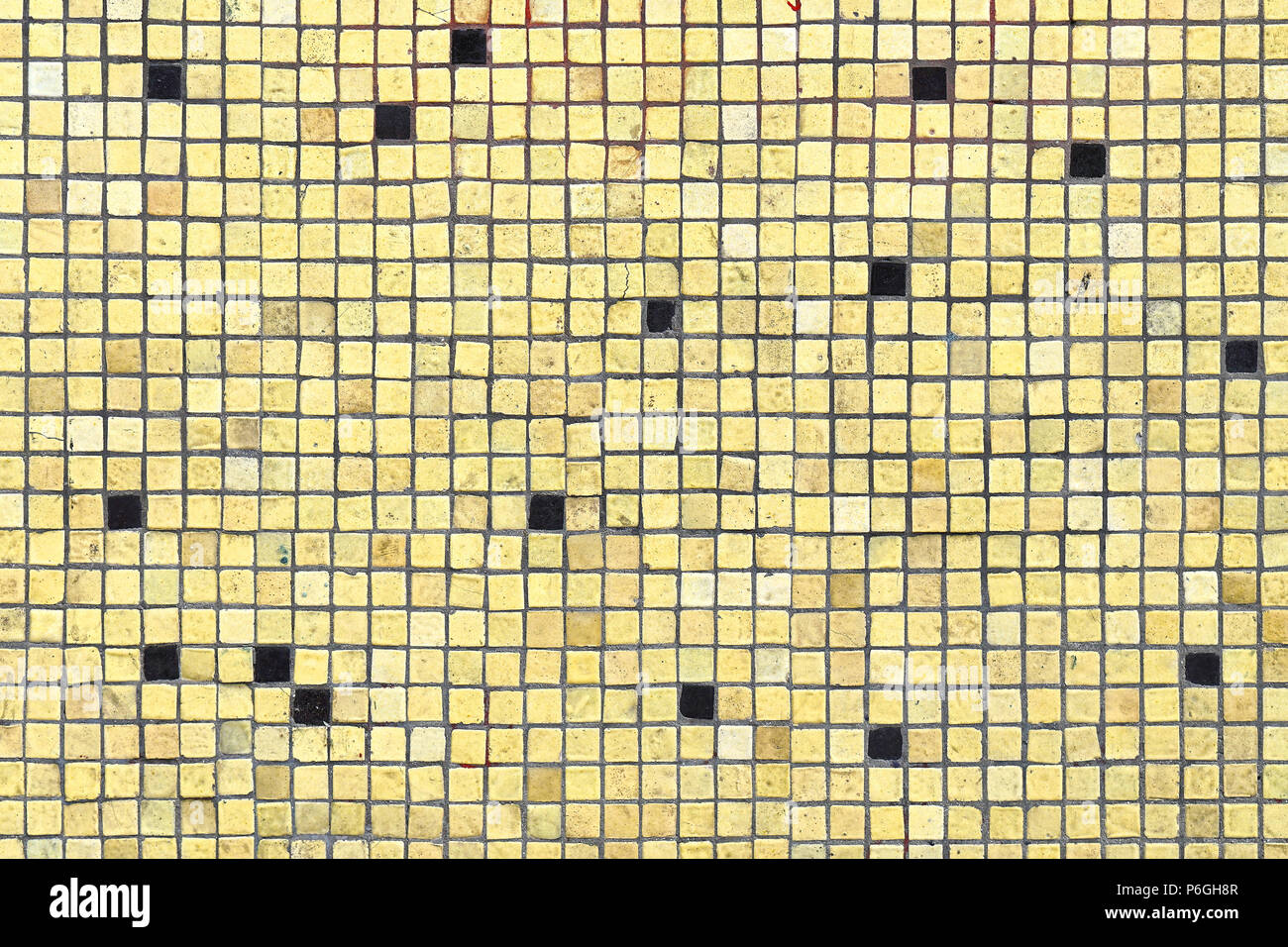 Grunge yellow small mosaic tiles wall Stock Photo - Alamy