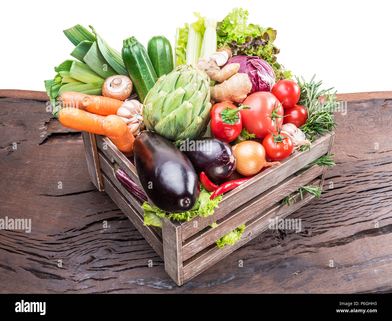 Fresh multi-colored vegetables in wooden crate Stock Photo - Alamy