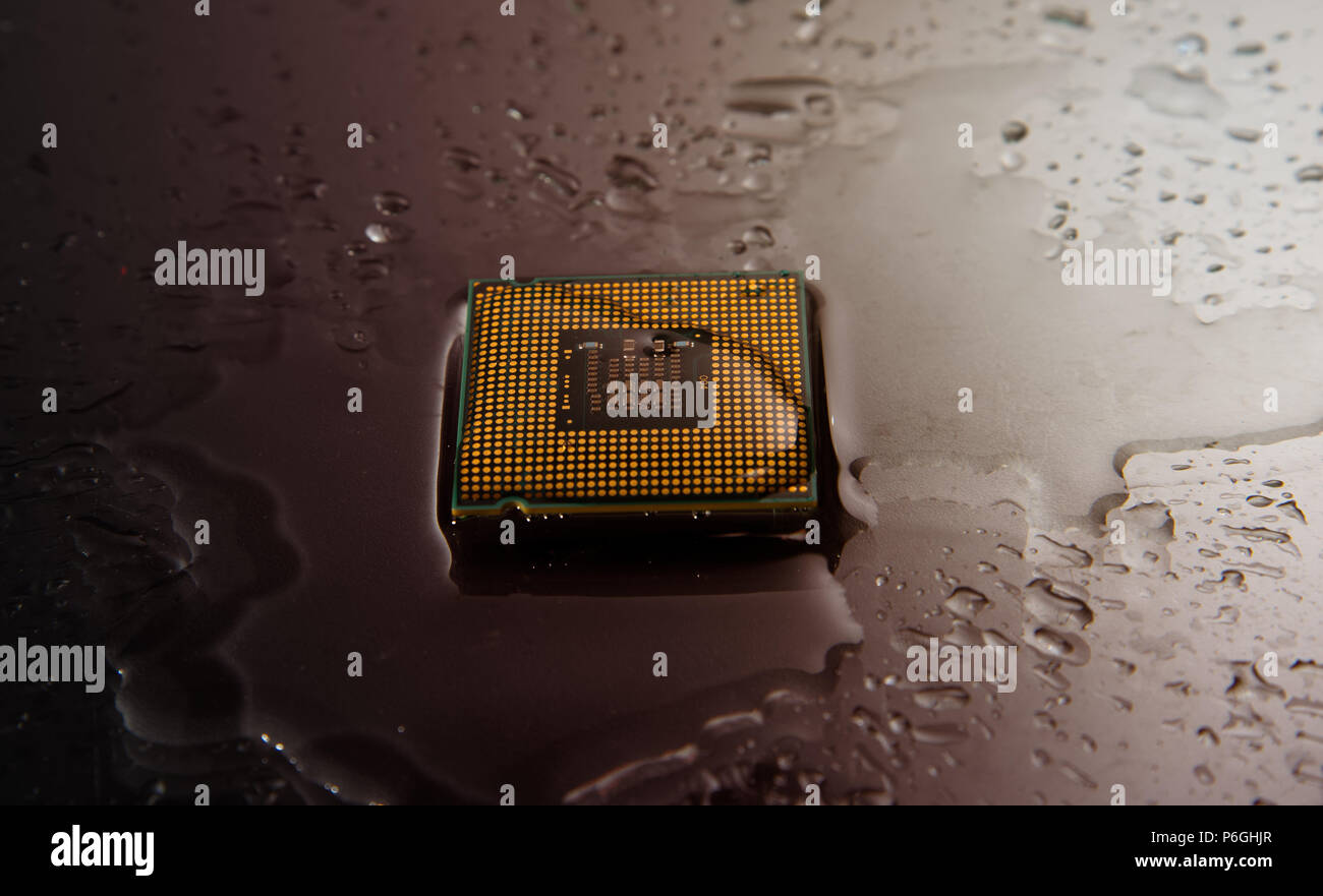 CPU wet, CPU on dark board and water on central chipset Stock Photo - Alamy