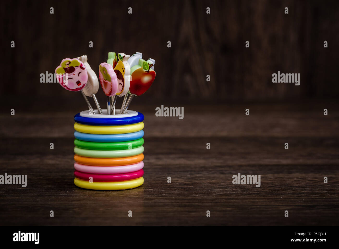 Colorful dessert forks with colorful trinket handles in colorful ...