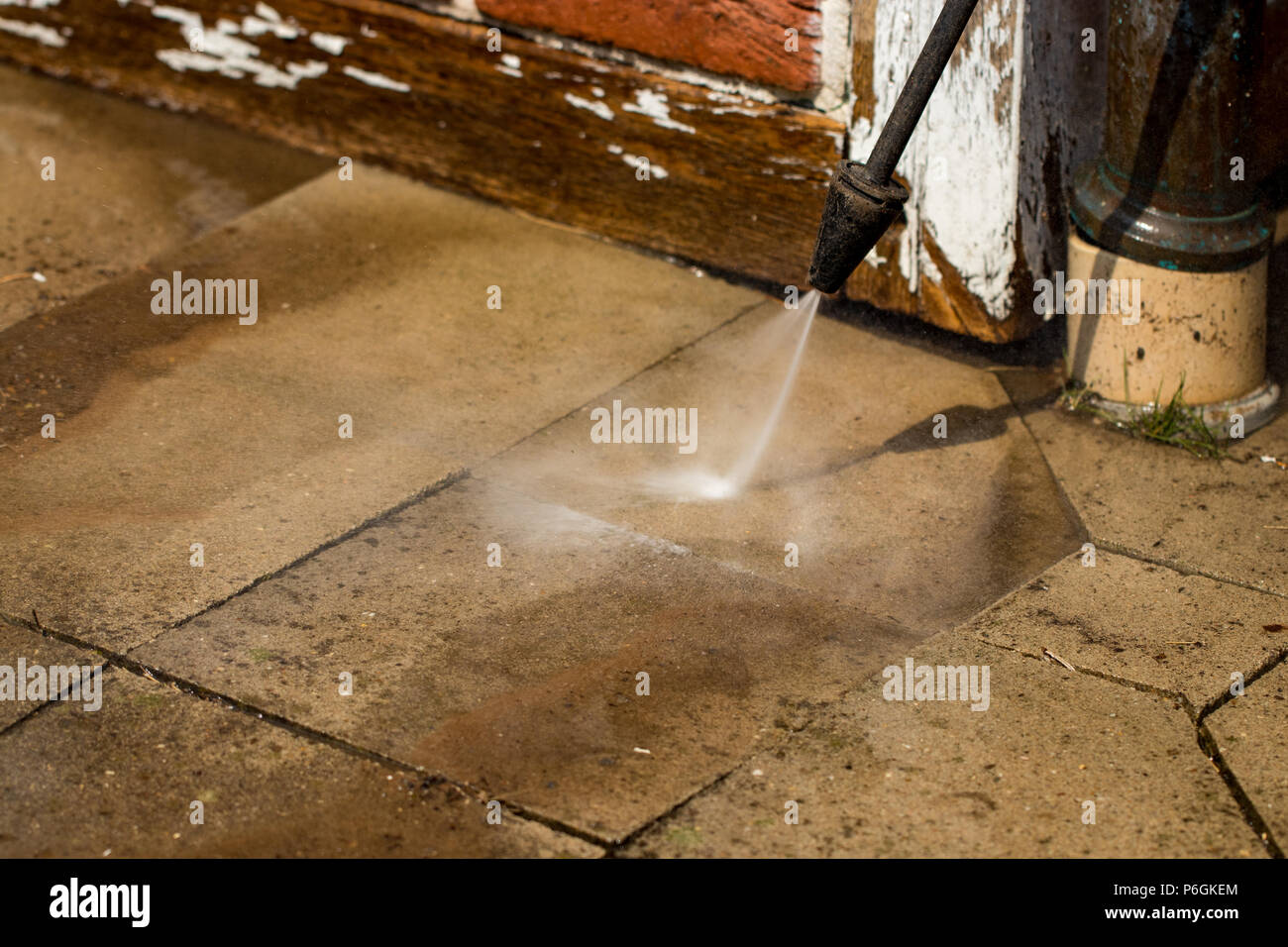 cleaning the wall high pressure cleaner, close up Stock Photo - Alamy