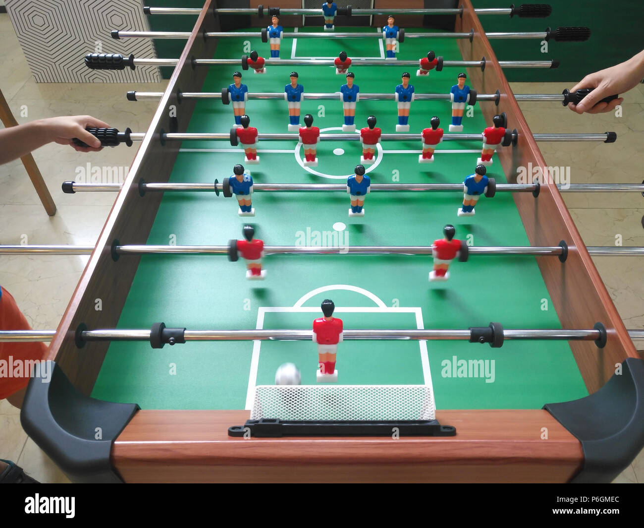 Kid playing soccer table game hi-res stock photography and images - Alamy