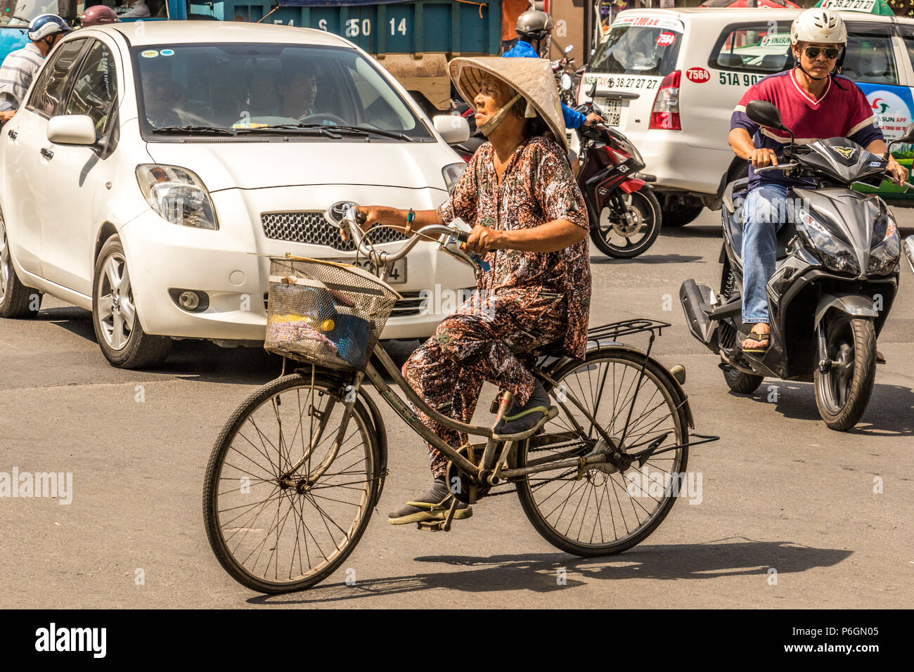 Street life night and day Ho Chi Minh (Saigon) Vietnam Stock Photo - Alamy