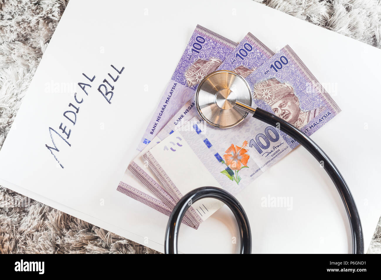 Stethoscope with wording of "Medical Bill" showing expensive healthcare ...