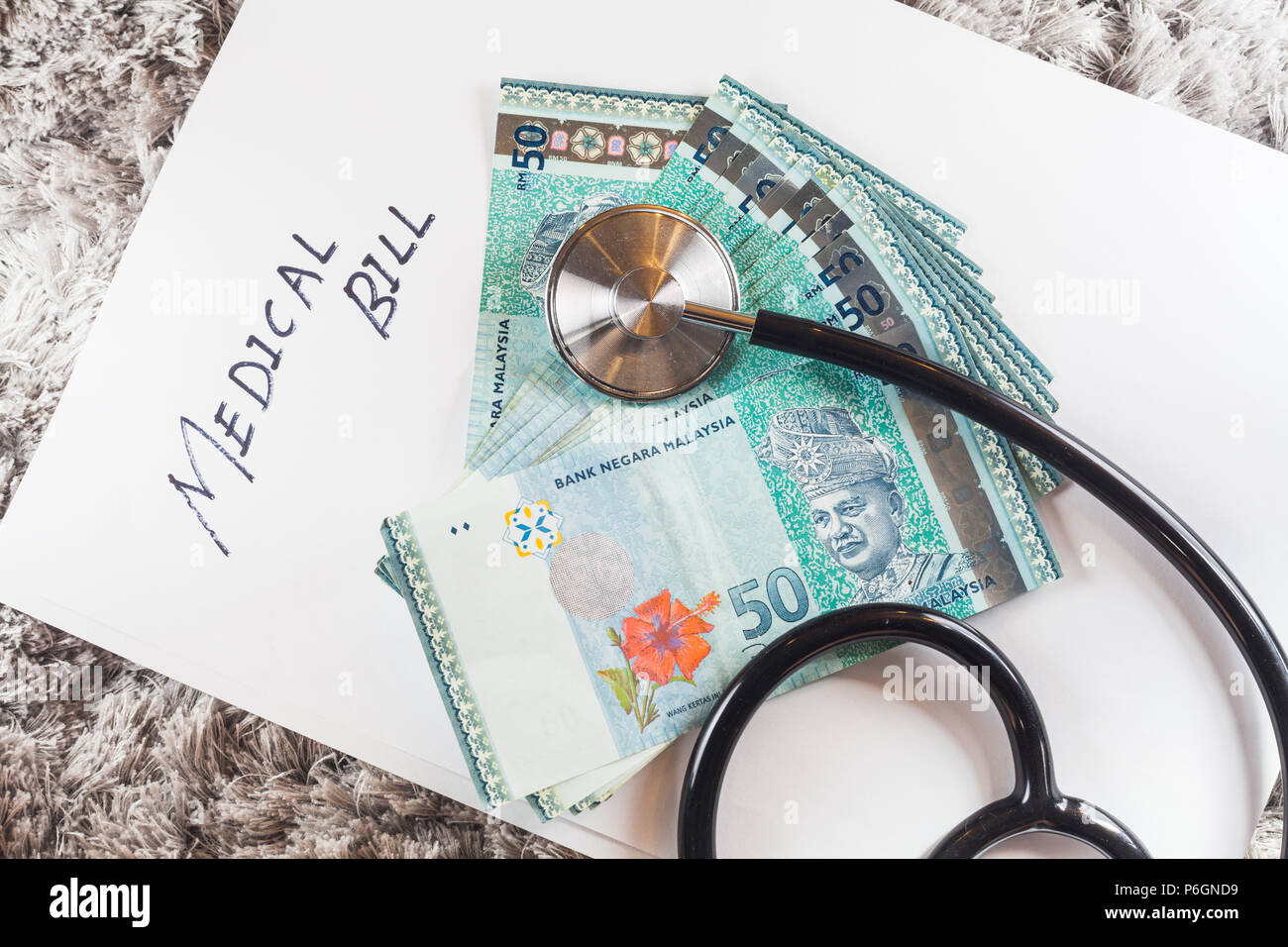 Stethoscope with wording of "Medical Bill" showing expensive healthcare ...