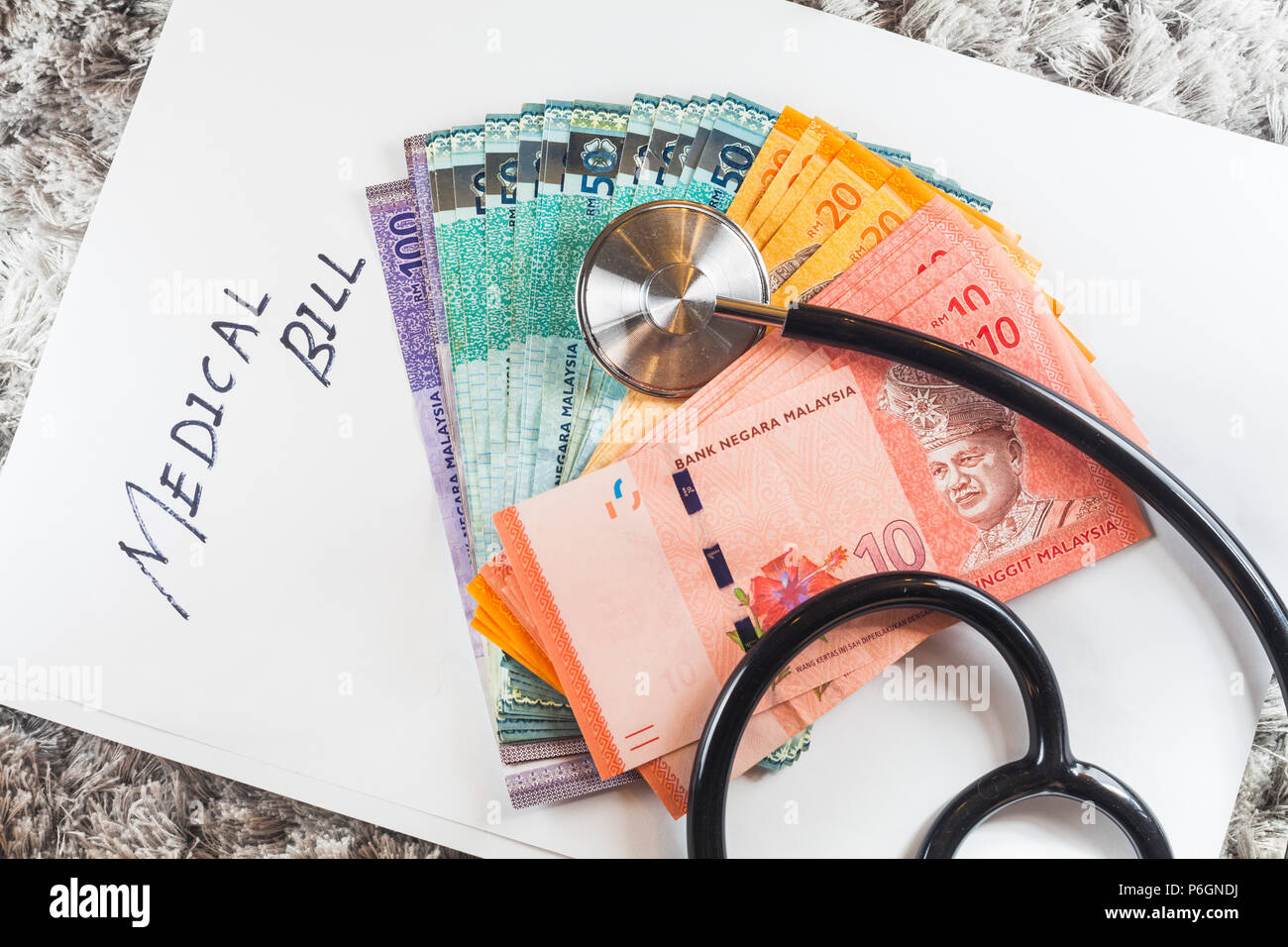Stethoscope with wording of "Medical Bill" showing expensive healthcare ...