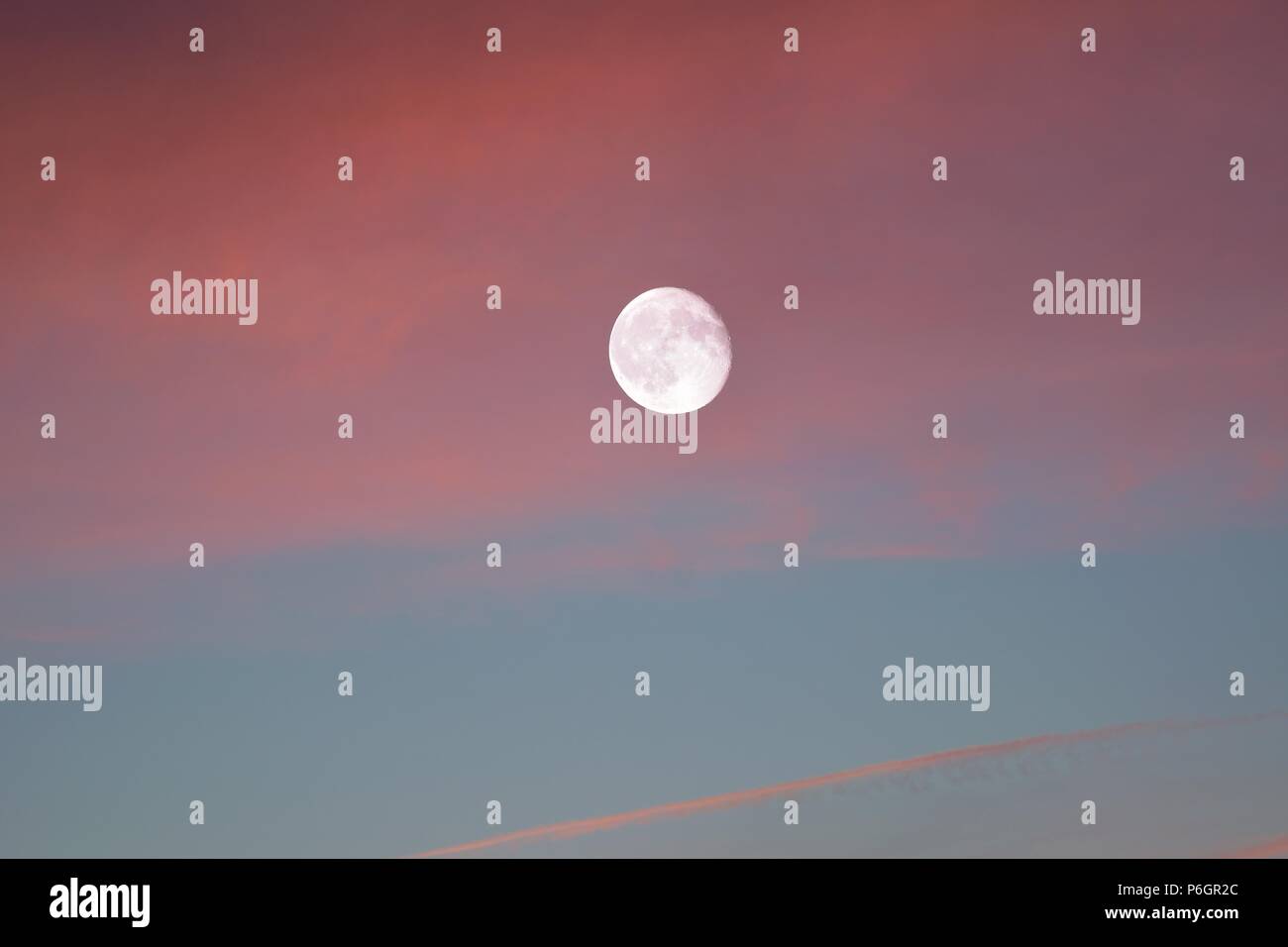 Nature background of shining full moon in dusk sky Stock Photo - Alamy