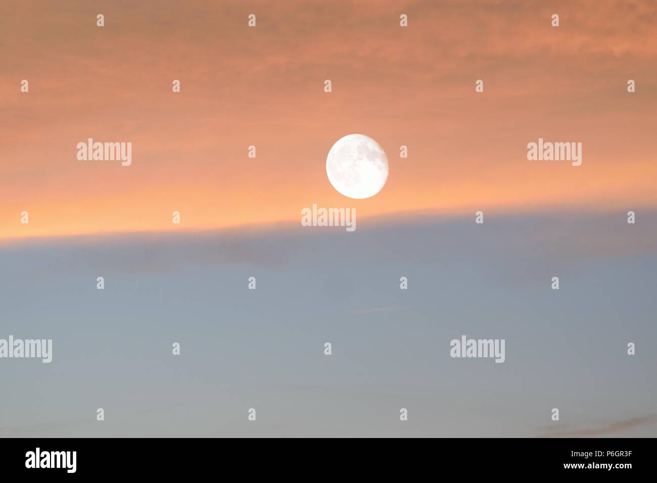 Nature background of shining full moon in dusk sky Stock Photo - Alamy