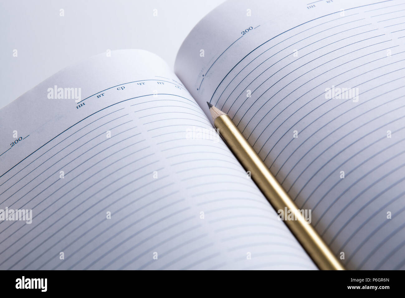 open diary with shiny pencil Stock Photo - Alamy