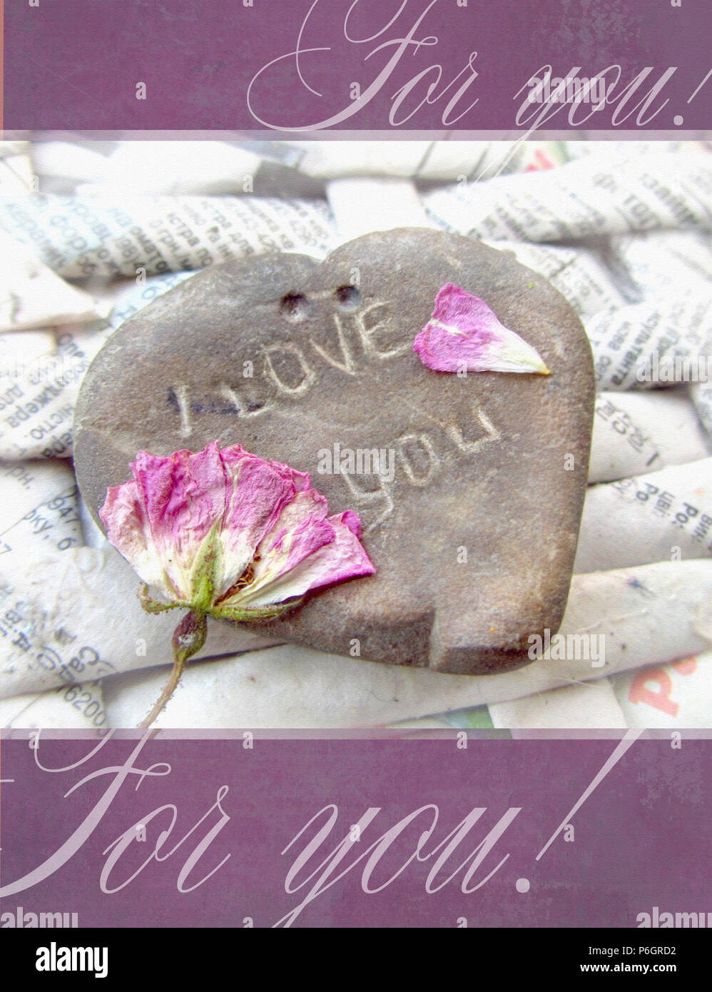 Greeting card. Stone in form of heart with the words I Love You and ...