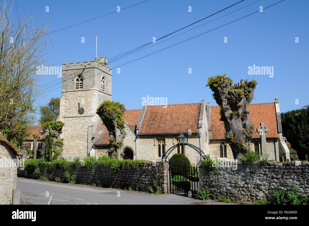 St Nicholas Church, Cuddington, Buckinghamshire, stands inside a stone ...