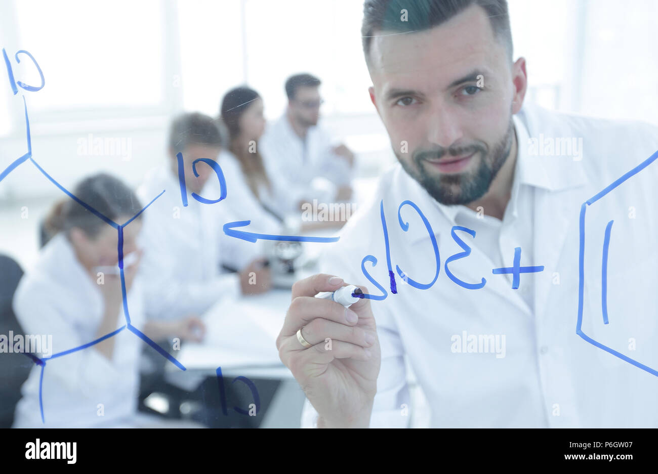 closeup of a serious scientist working with formulas Stock Photo - Alamy