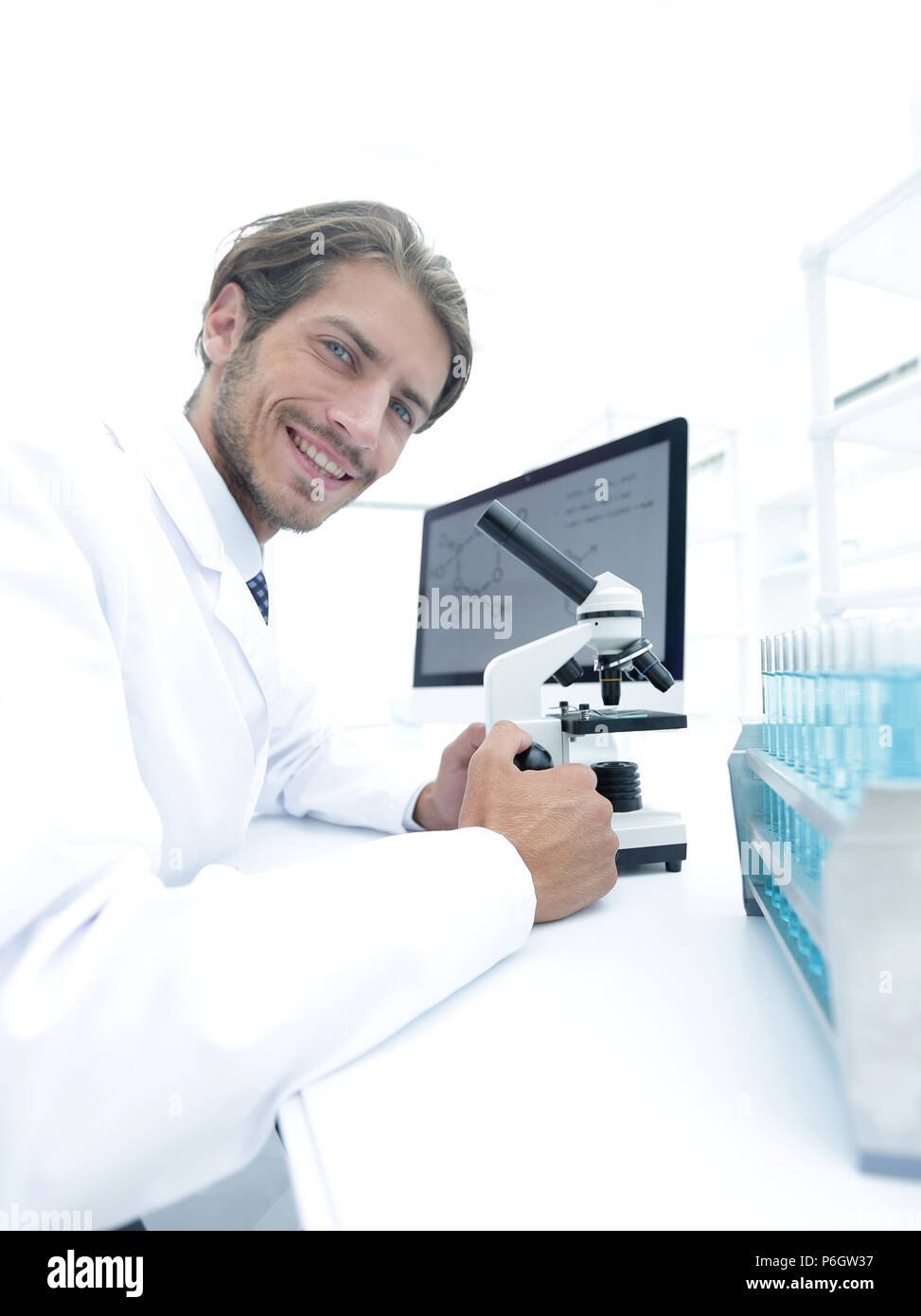 Student in biology using microscope in training class Stock Photo - Alamy