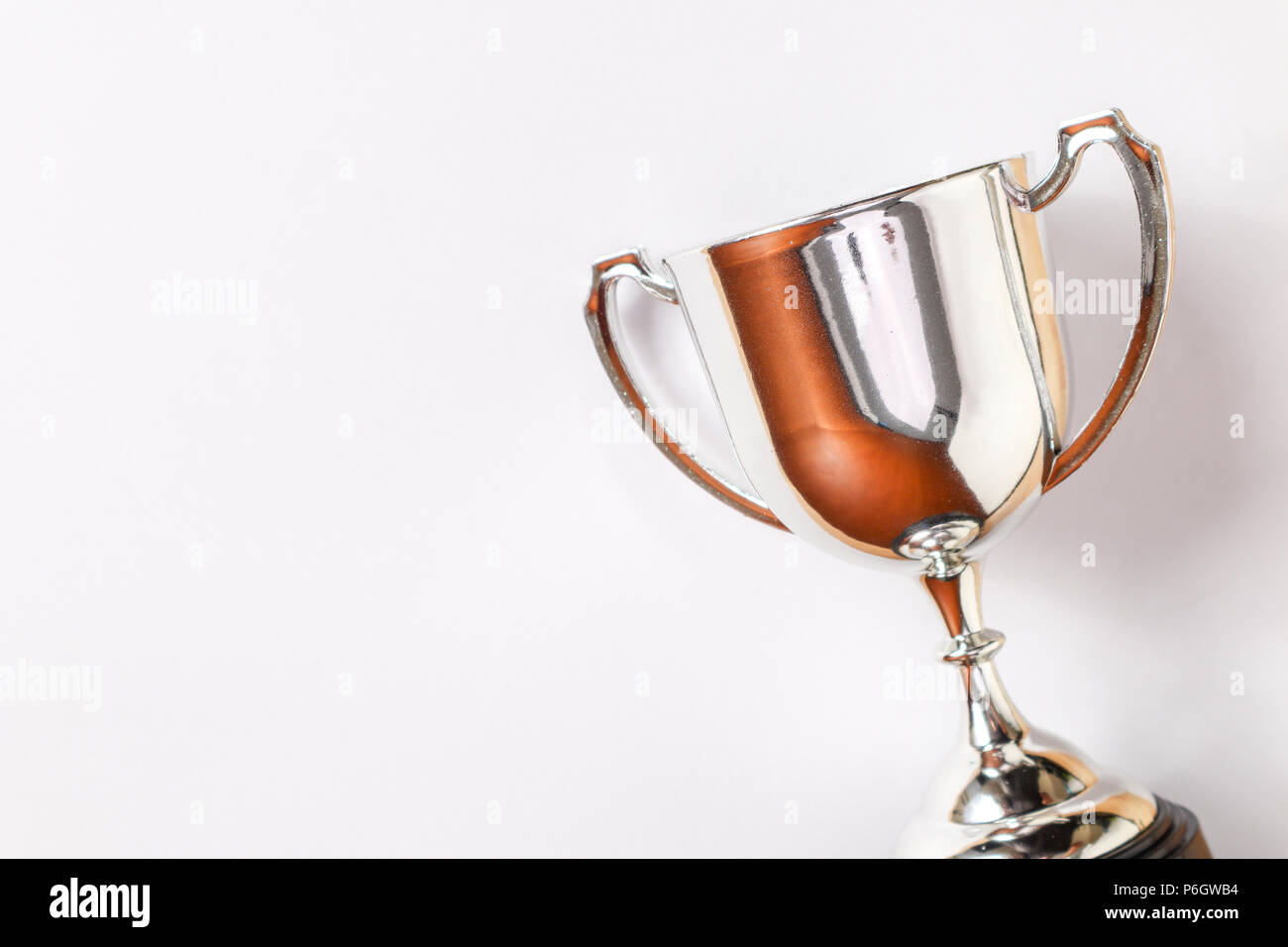 winner concept silver trophy placed with background Stock Photo - Alamy