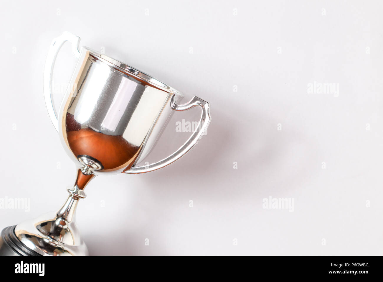 winner concept silver trophy placed with background Stock Photo - Alamy