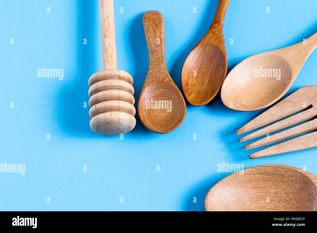 Wooden spoon on blue background, for background menu food Stock Photo ...