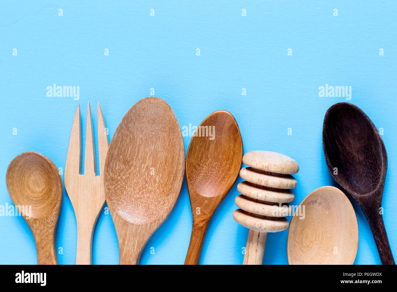 Wooden spoon on blue background, for background menu food Stock Photo ...