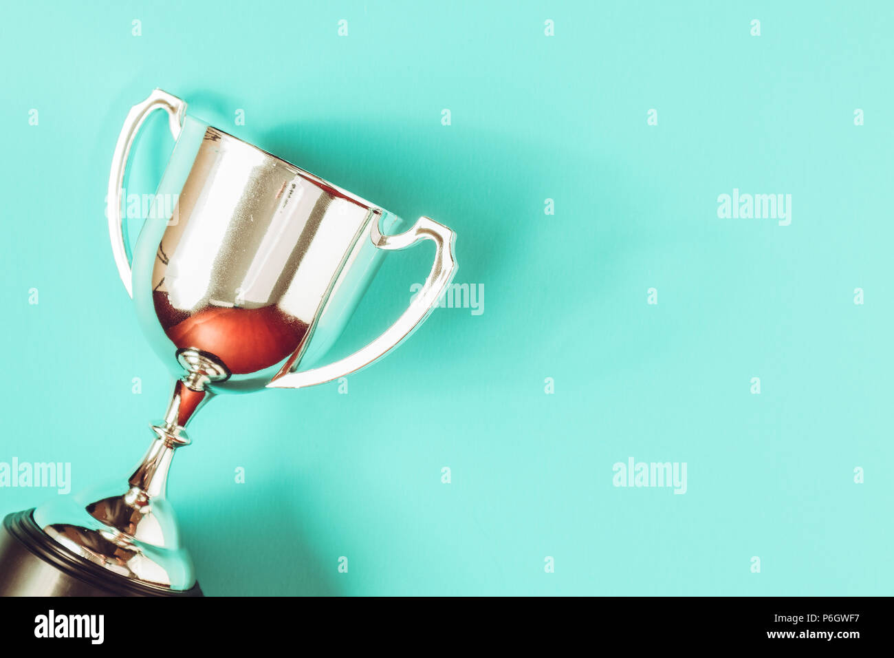 winner concept silver trophy placed with background Stock Photo - Alamy