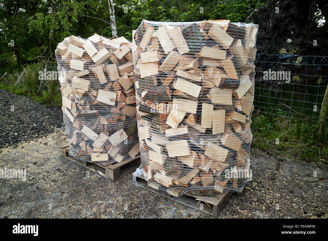 pallets of sawn cut wood logs in the cumbria england uk Stock Photo - Alamy
