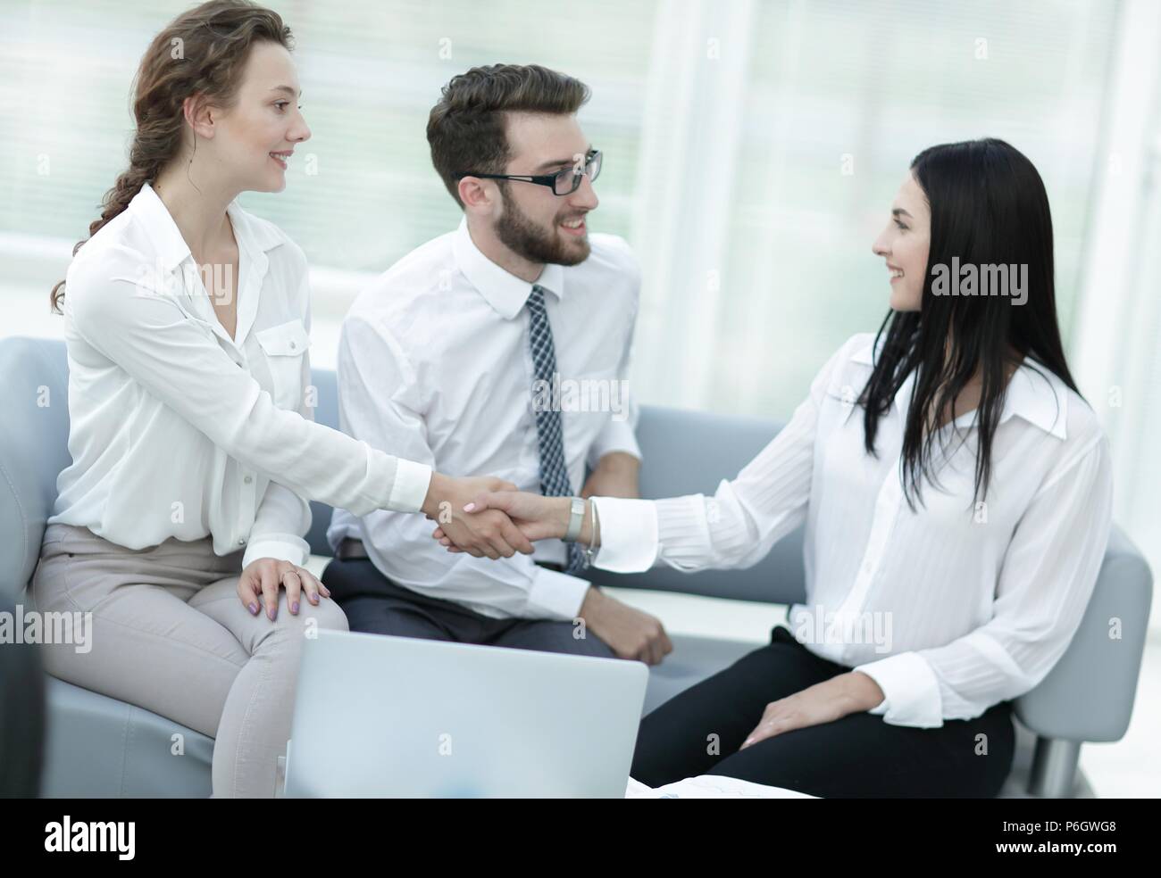 handshake of manager and client in the office lobby Stock Photo - Alamy