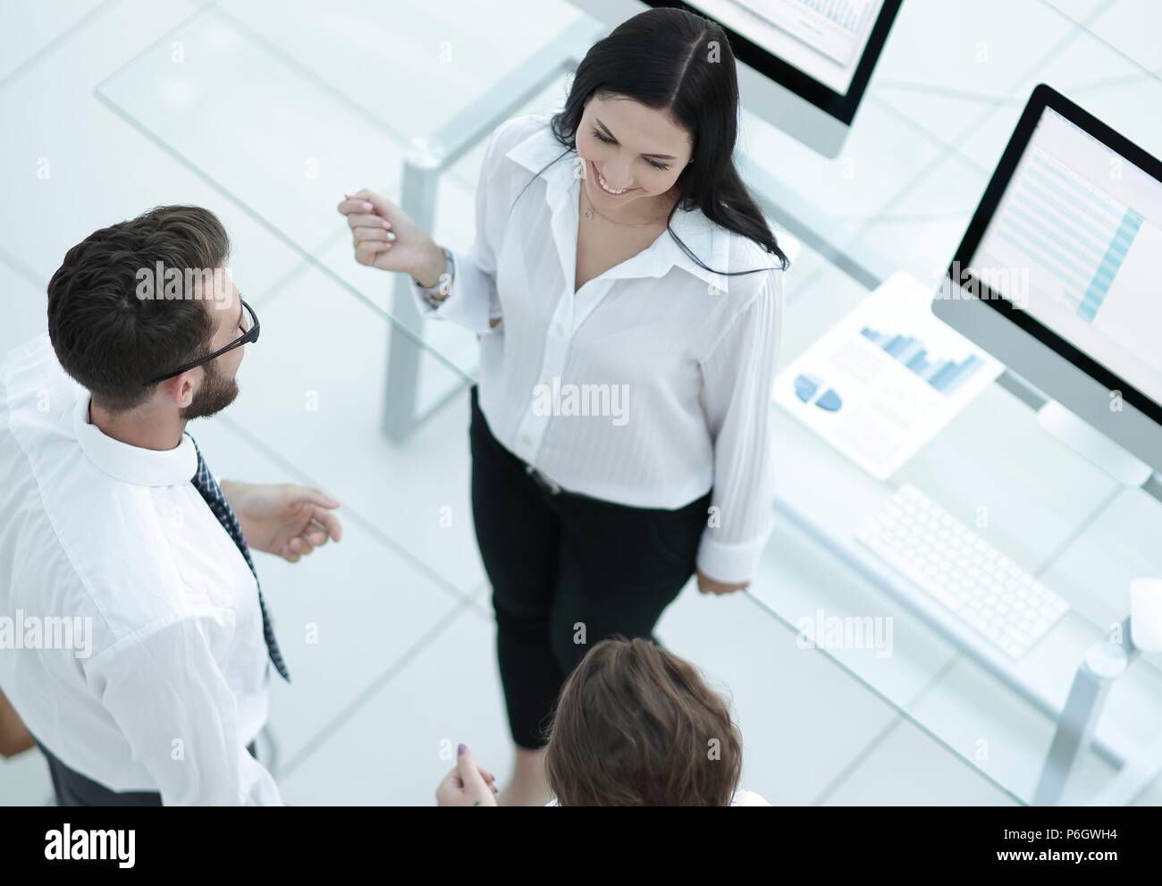 company employees are talking in the office Stock Photo - Alamy