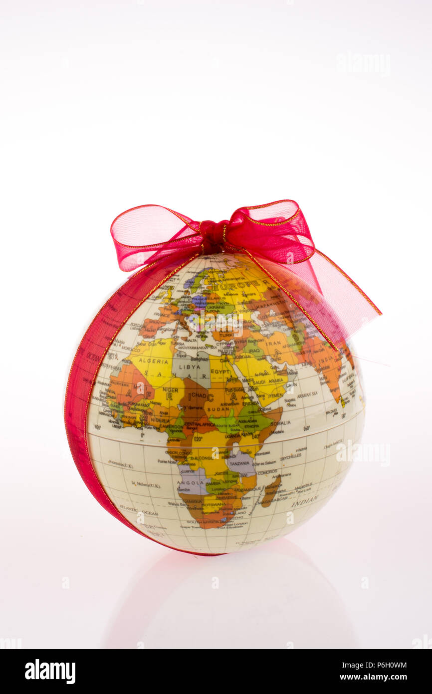 Globe tied with red ribbon on a white background Stock Photo - Alamy