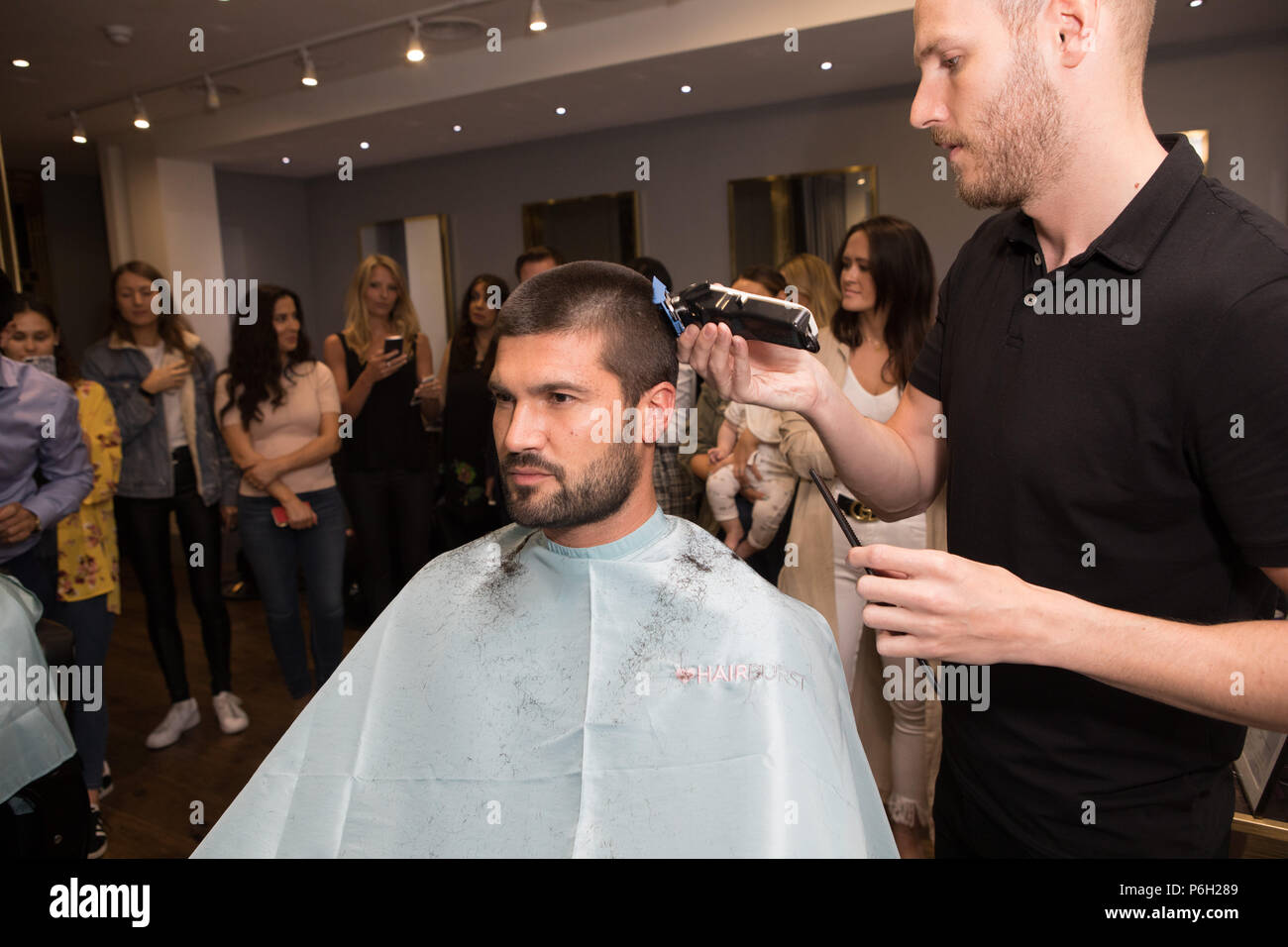 Dan Edgar takes part in a charity head shave, along with Love Island ...