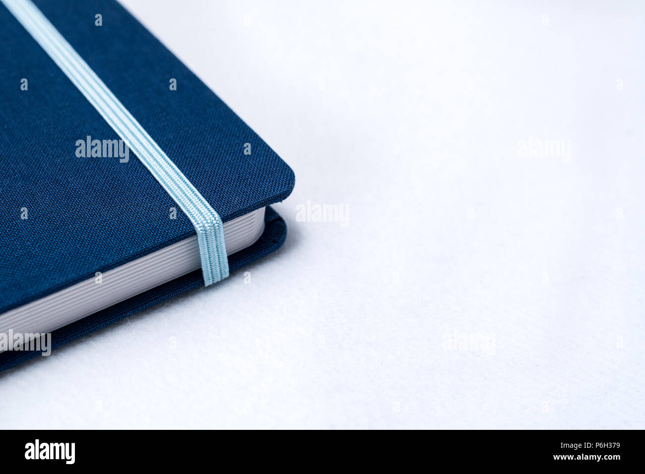 Blue notebook and a Pen isolated on a white background for business ...
