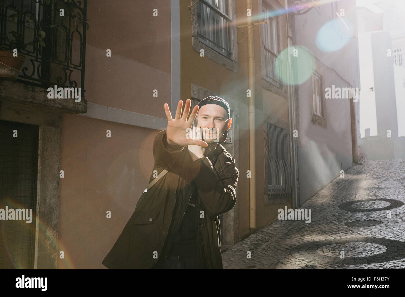 Young guy tourist on the street in Lisbon in Portugal talking on the ...
