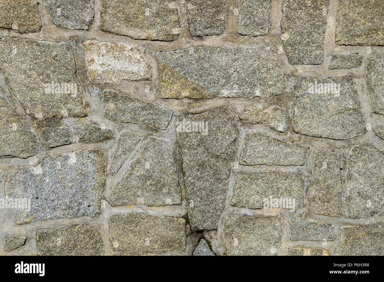 Granite wall with structure and joints as a texture and background ...