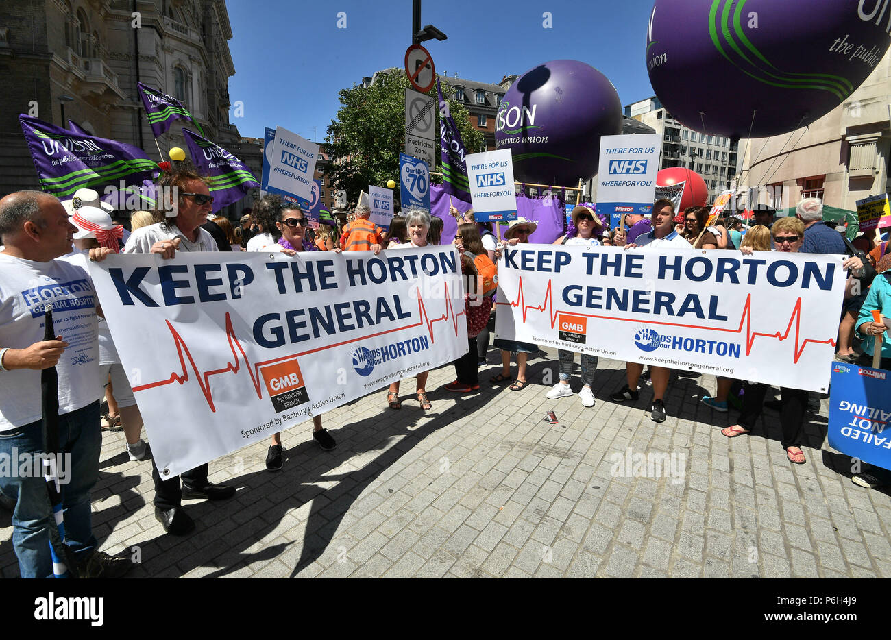 People march in central London to mark the 70th anniversary of the NHS ...