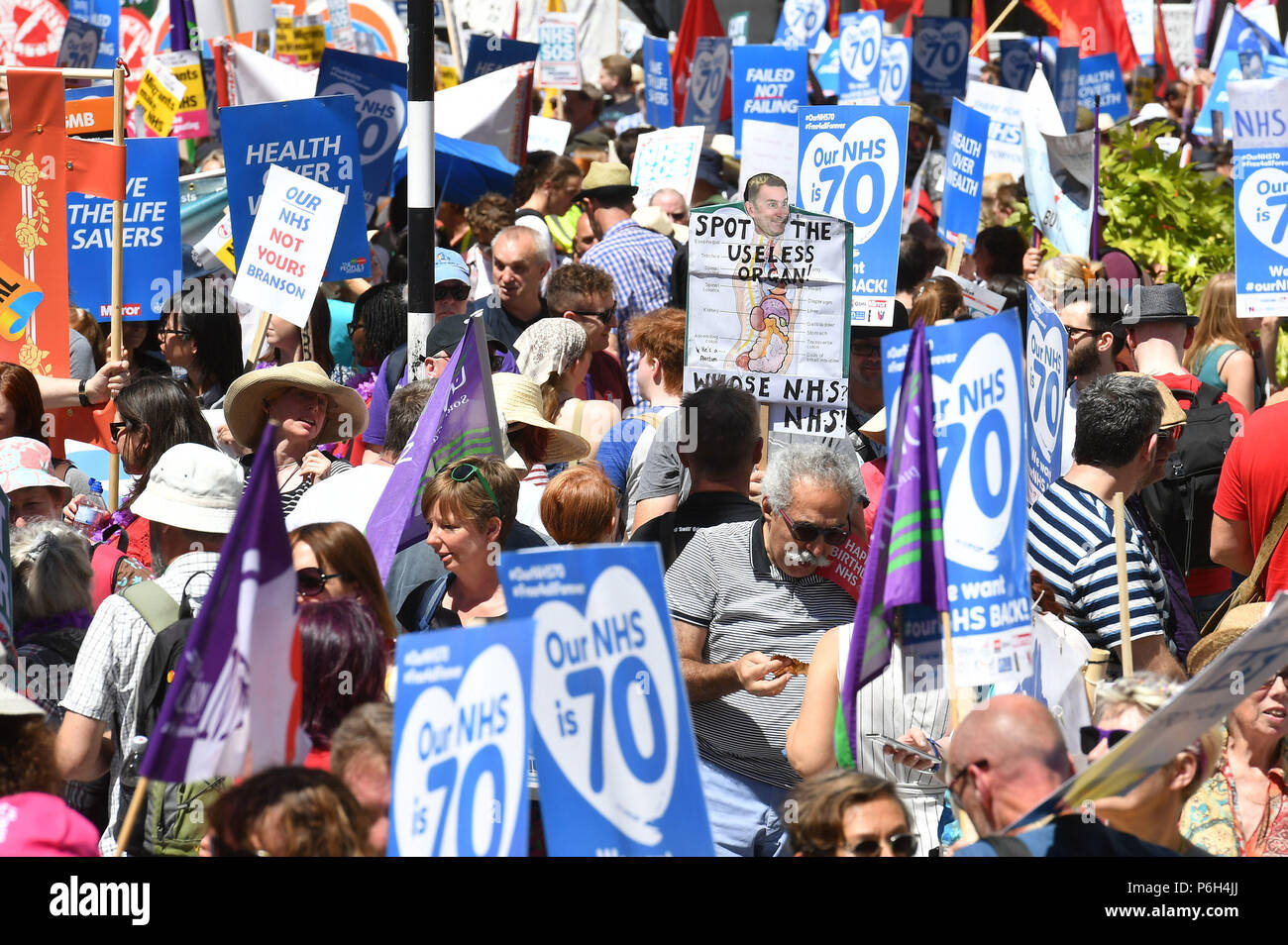 People march in central London to mark the 70th anniversary of the NHS ...