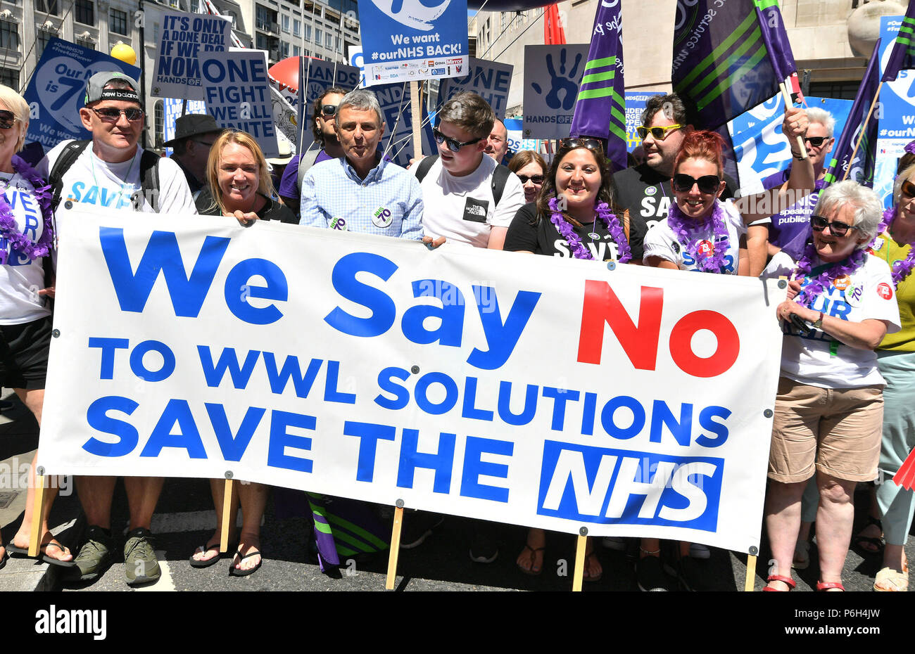 People march in central London to mark the 70th anniversary of the NHS ...